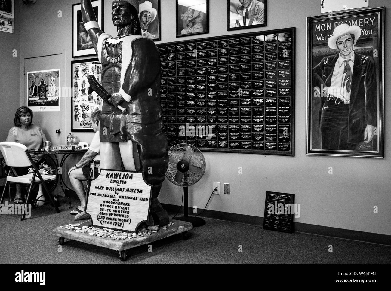 Interior of the Hank Williams Museum with framed photos and posters and ...