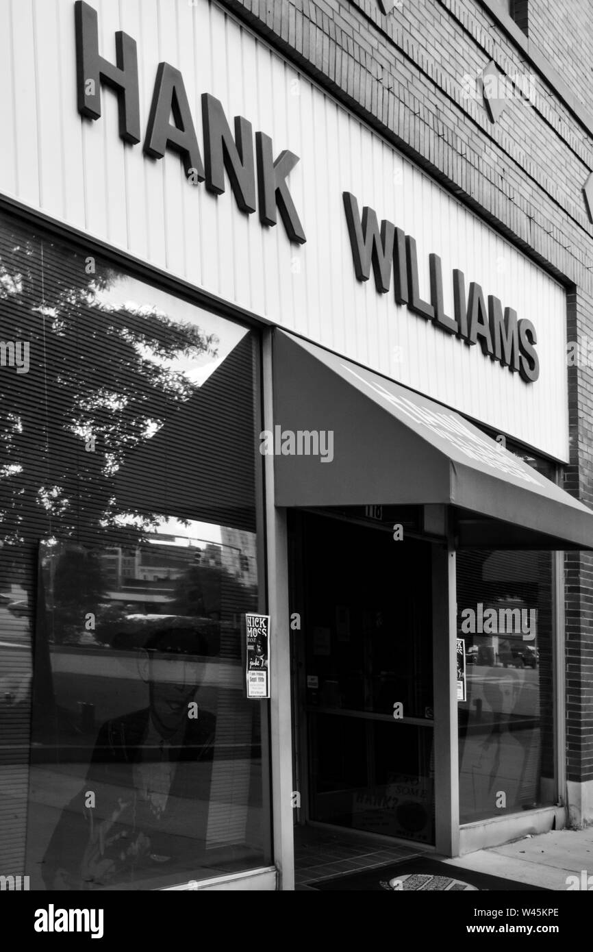 Overhead sign and blue awning at entrance to historic old building now ...