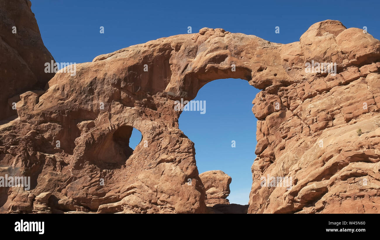 low angle shot of turret arch in utah Stock Photo - Alamy