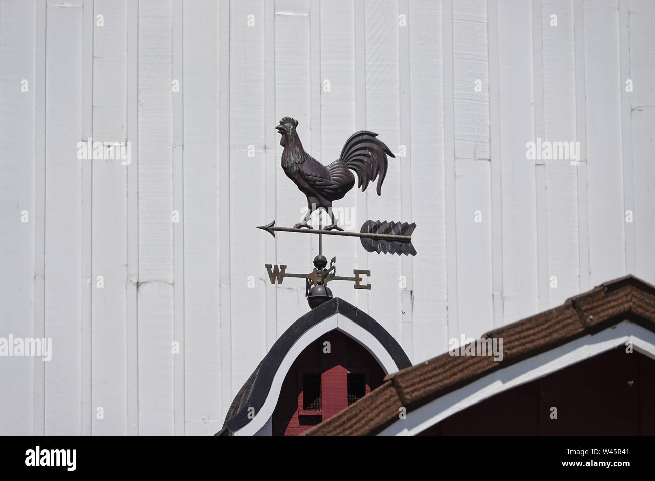 Weathercock on a roof of a farm building Stock Photo - Alamy