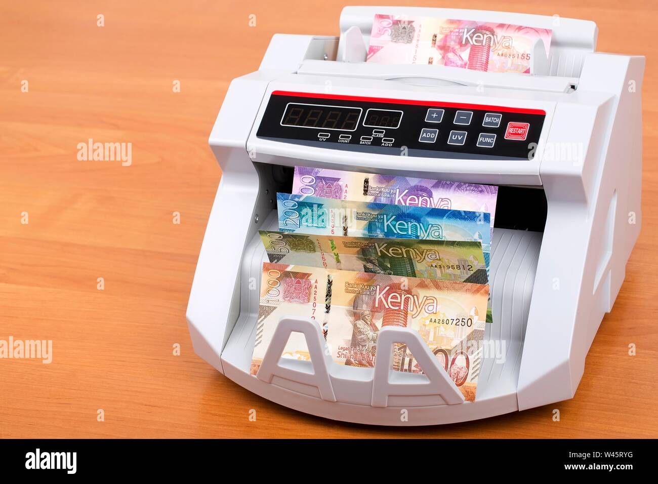 Kenyan Shillings in the counting machine Stock Photo - Alamy