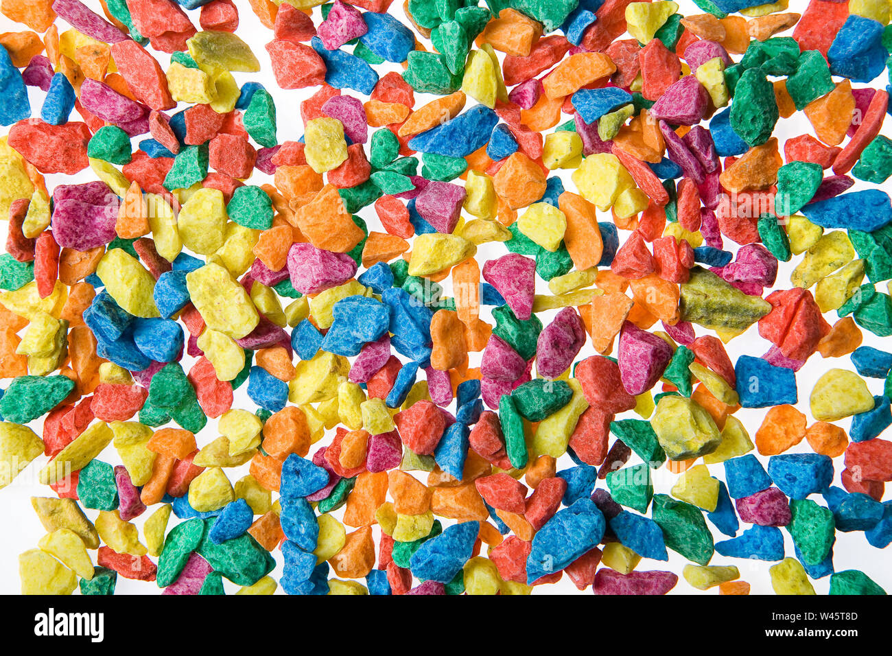 Little coloured stones on isolated background Stock Photo - Alamy