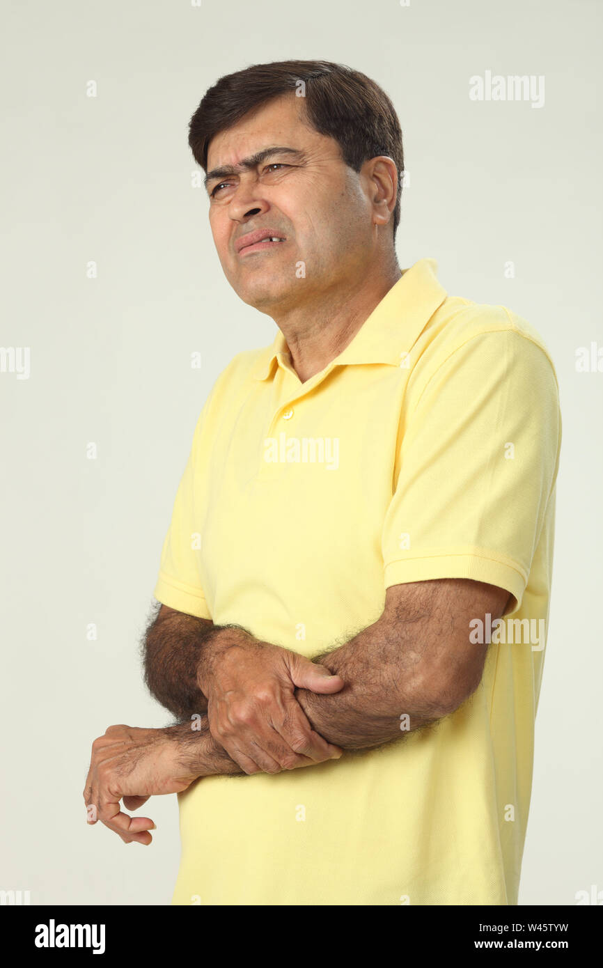 Man suffering from hand pain Stock Photo - Alamy