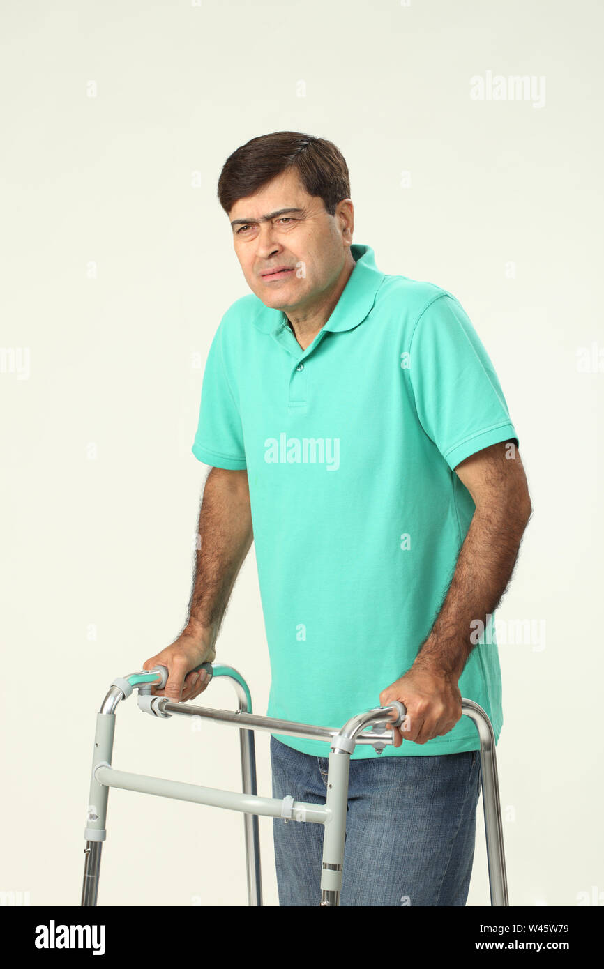 Man walking with a walker Stock Photo - Alamy