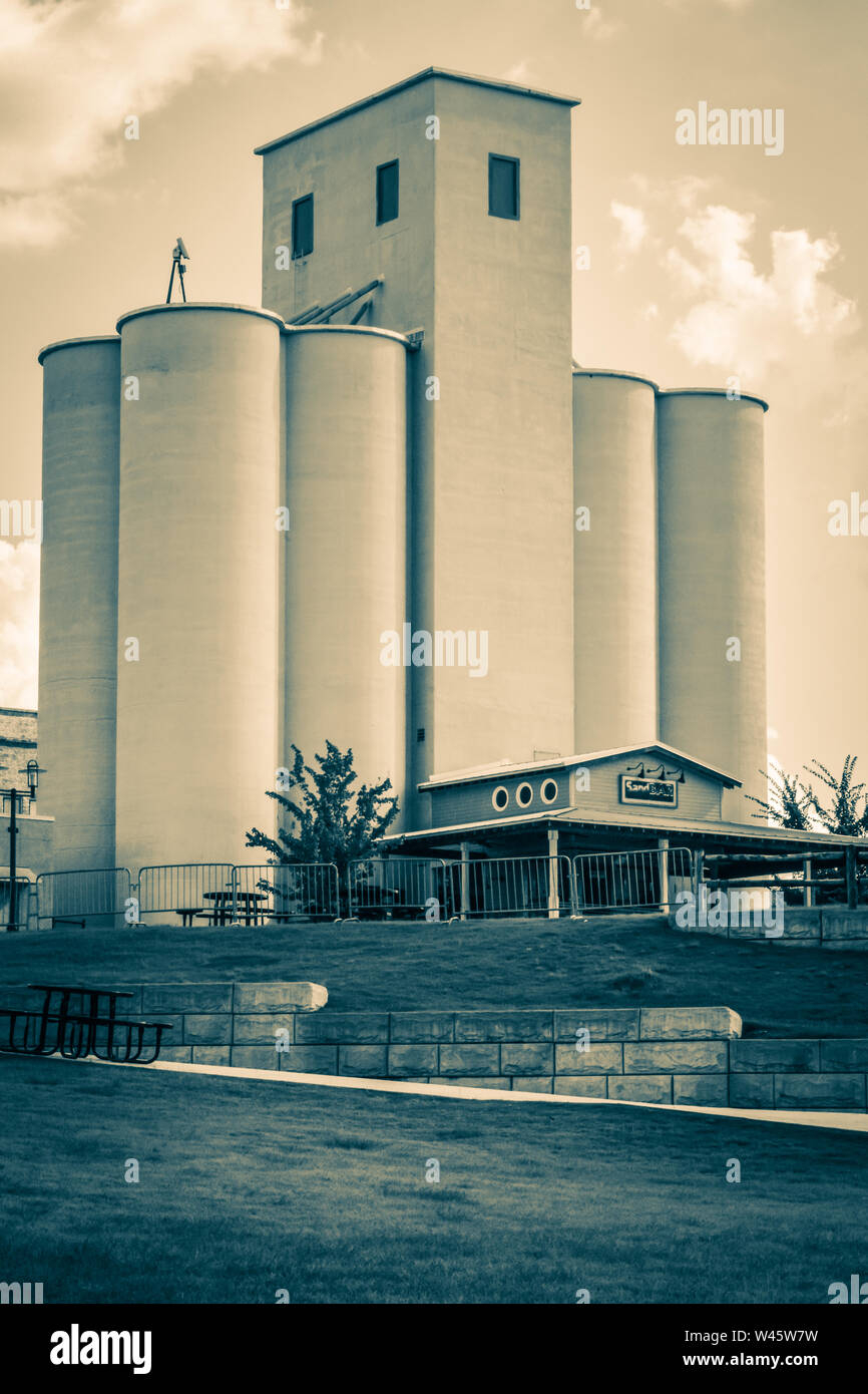 Agriculture buildings and Vintage grain silos in front of the "SanBar ...