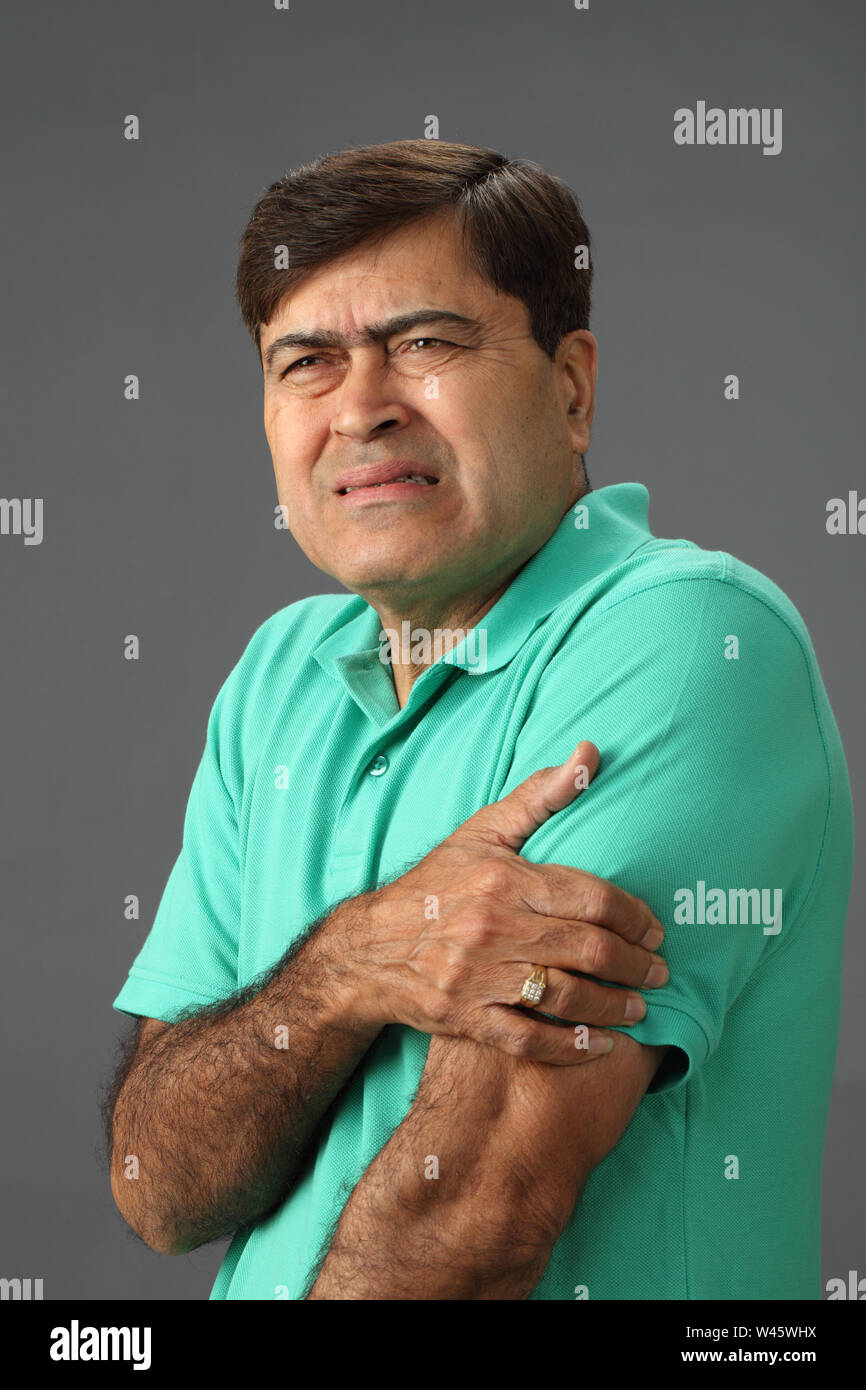 Man suffering from hand pain Stock Photo - Alamy