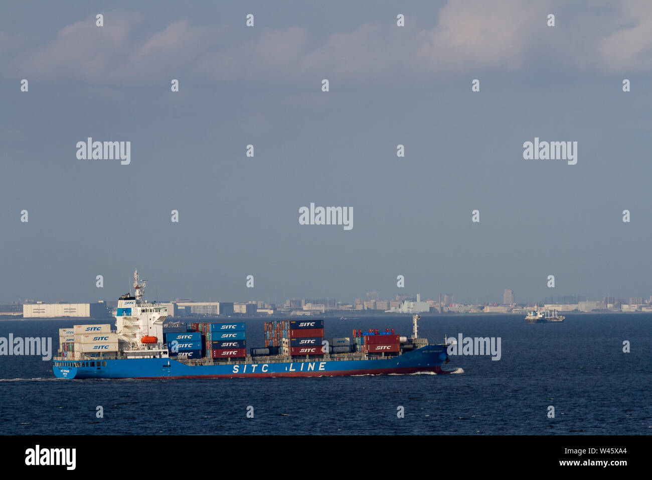A container ship sailing out of Tokyo Bay, Tokyo, Japan Stock Photo - Alamy