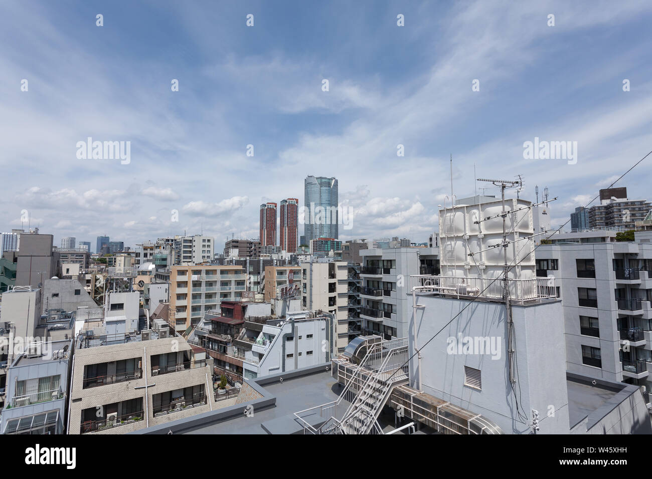 Roppongi Hills tower seen over urban sprawl in Azabu Juban, Tokyo, Japan Stock Photo - Alamy