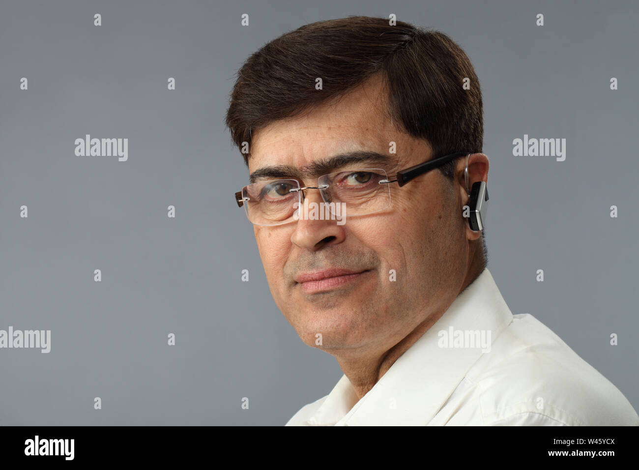 Man wearing hands-free device Stock Photo - Alamy