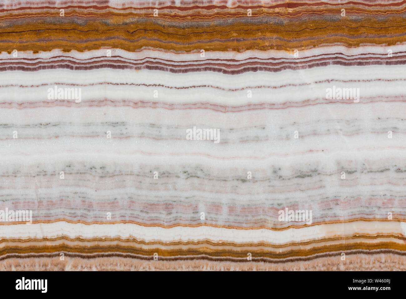Structure of the multi colored onyx stone close up Stock Photo - Alamy