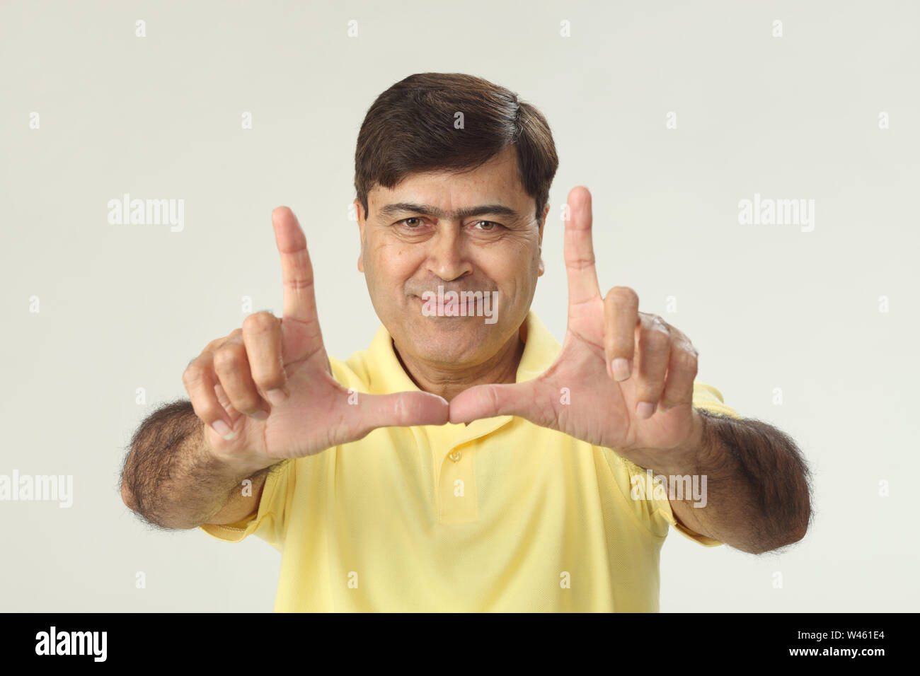 Film director framing a location or scene with his hands Stock Photo ...