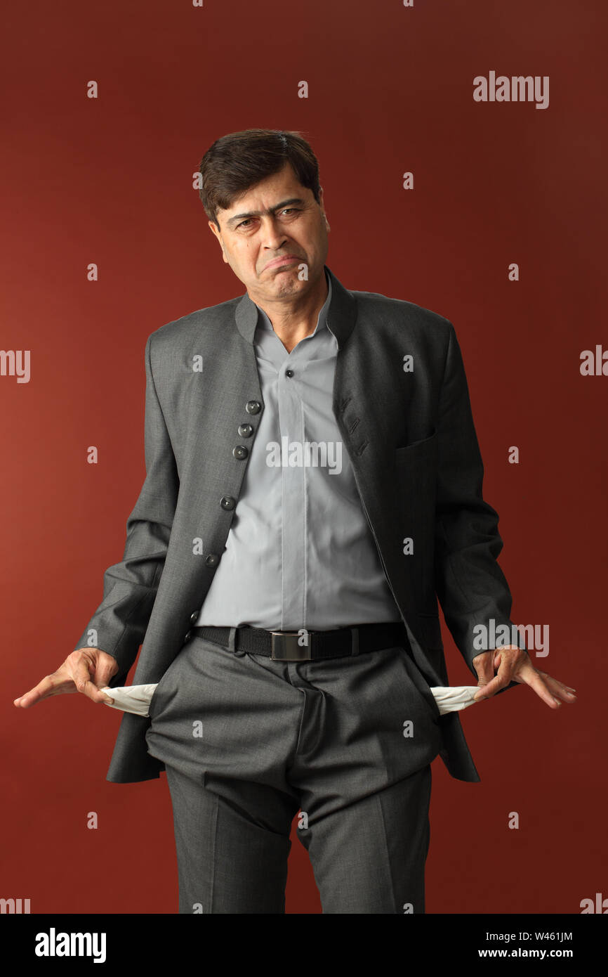Indian man showing empty pockets hi-res stock photography and images ...