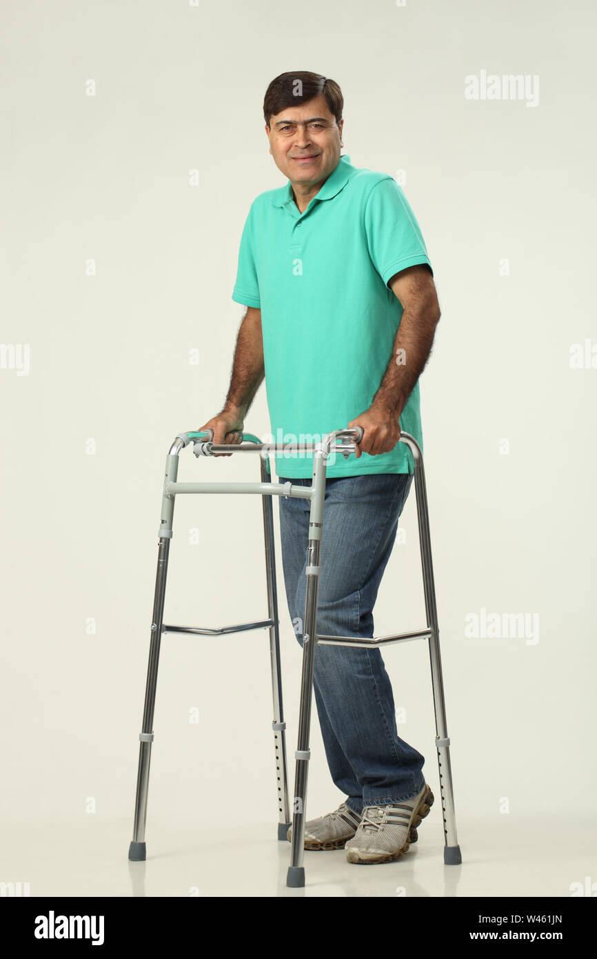 Indian old man walking walker hi-res stock photography and images - Alamy