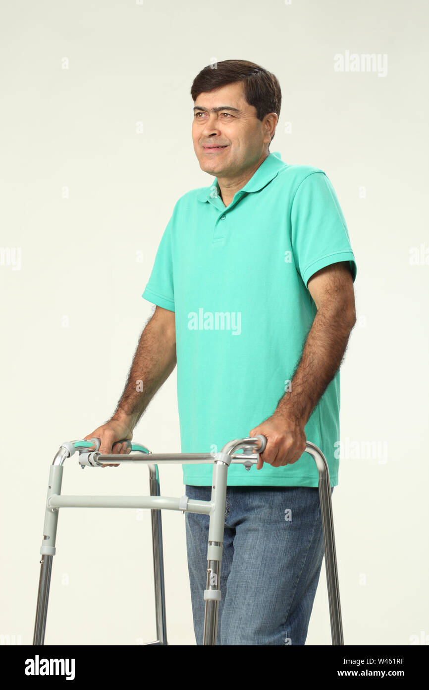 Indian old man walking walker hi-res stock photography and images - Alamy