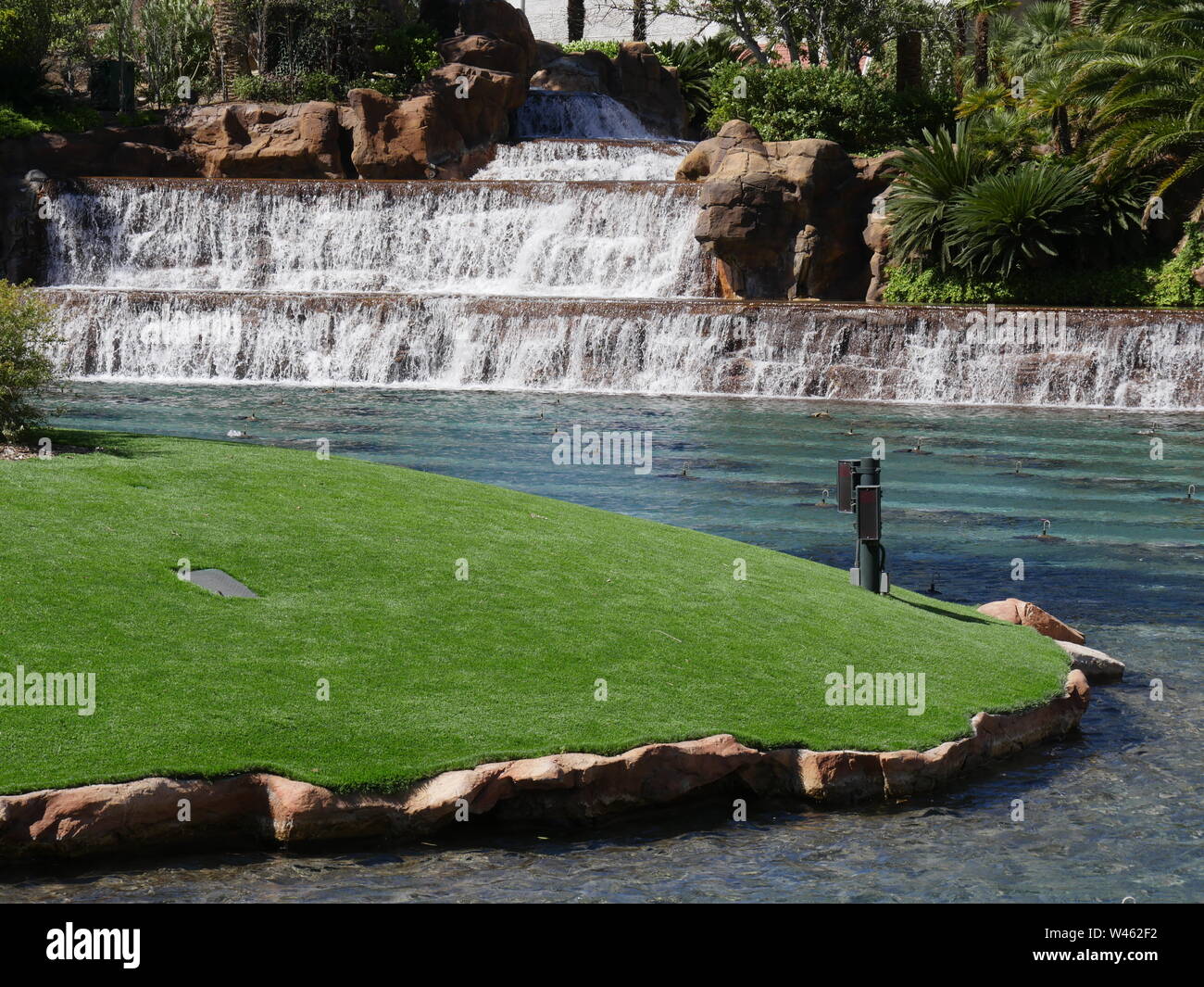 Medium wide shot of a landcaped garden with waterfalls Stock Photo - Alamy