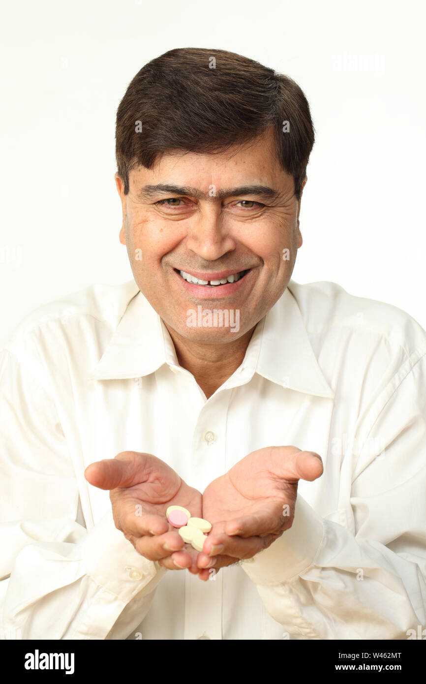 Man showing pills Stock Photo - Alamy