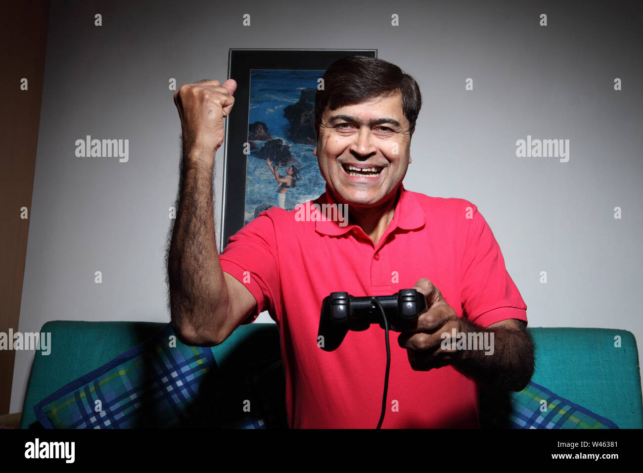 Man playing video game Stock Photo - Alamy