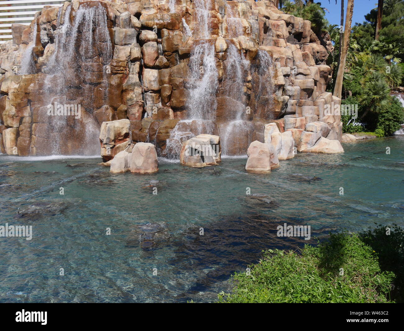 Beautiful landcaped garden with a man-made waterfalls Stock Photo - Alamy
