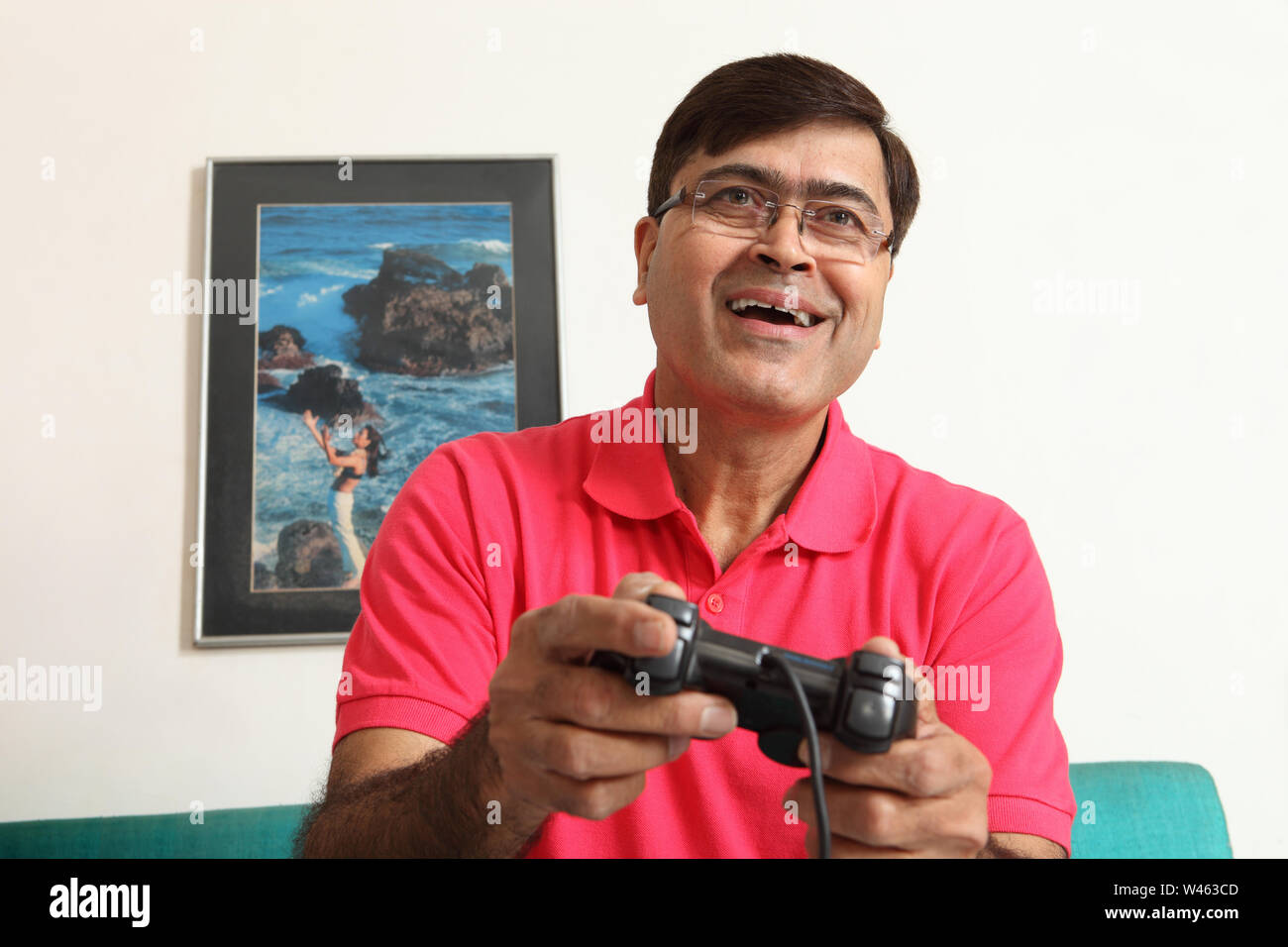 Man playing video game Stock Photo - Alamy
