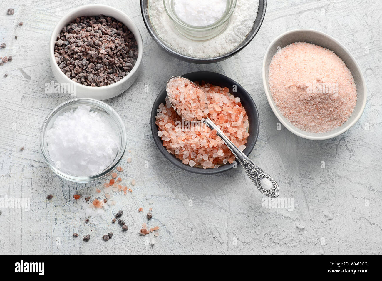 Different salt types on grey background. Top view with copy space Stock ...