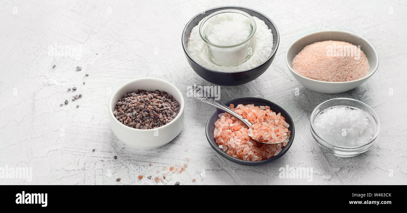 Different salt types on grey background. Image with copy space Stock ...
