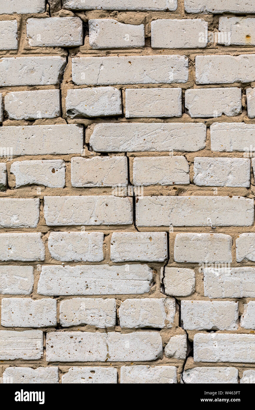 Deep cracked white silicate brick wall closeup texture and background ...