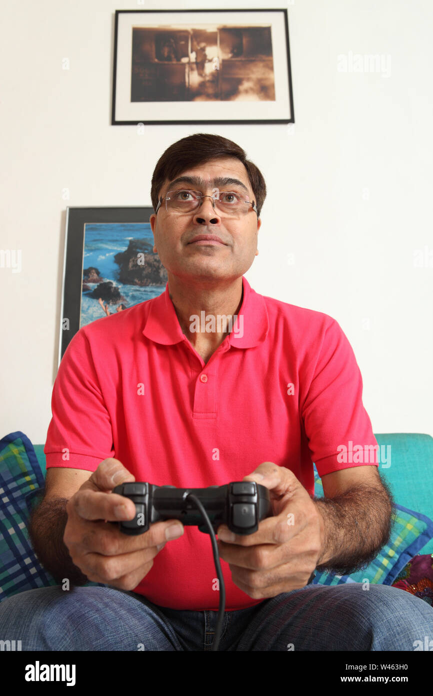 Man playing video game Stock Photo - Alamy