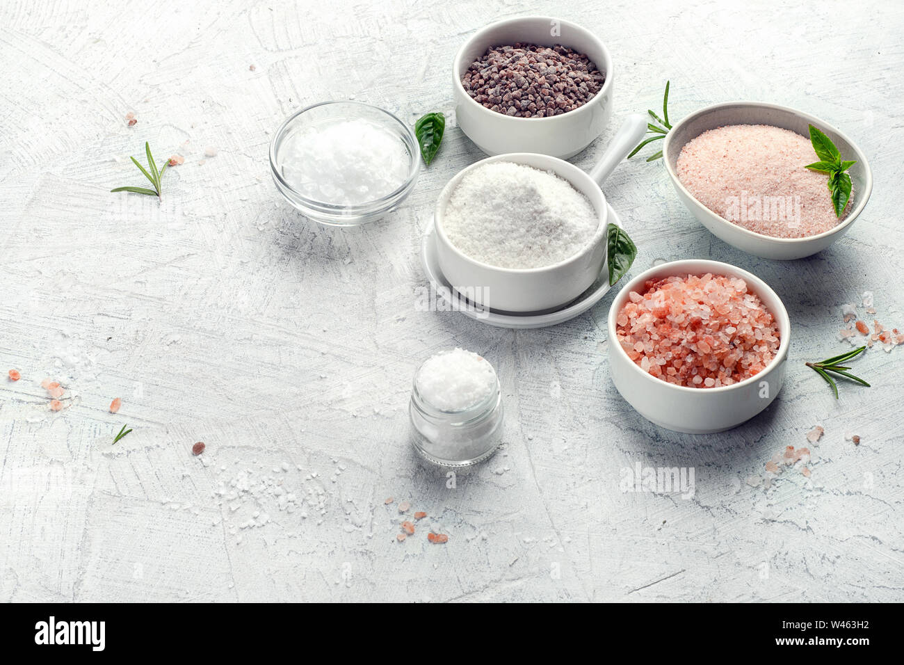 Different salt types on grey background. Top view with copy space Stock ...