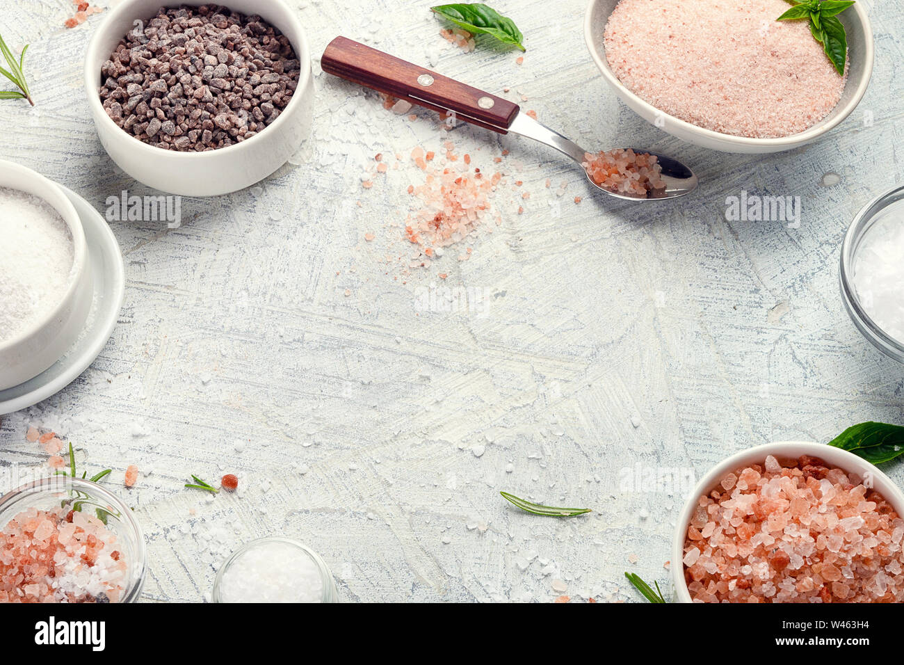 Different salt types on grey background. Top view with copy space Stock ...