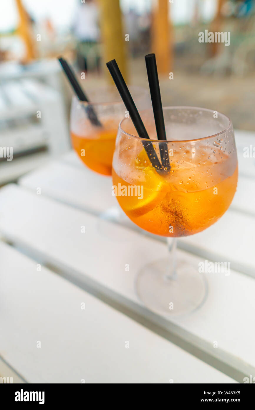 Delicious classic iced aperol spritz cocktail with ice cubes on a hot ...
