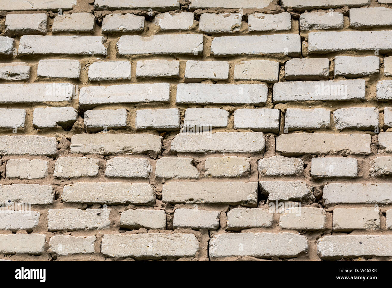 Deep cracked white silicate brick wall closeup texture and background ...