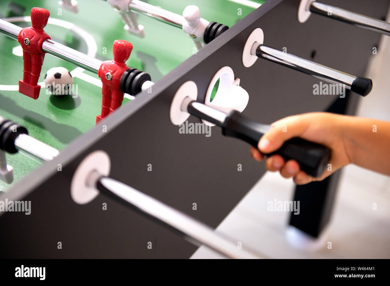 Foosball table soccer sport team football players Stock Photo - Alamy