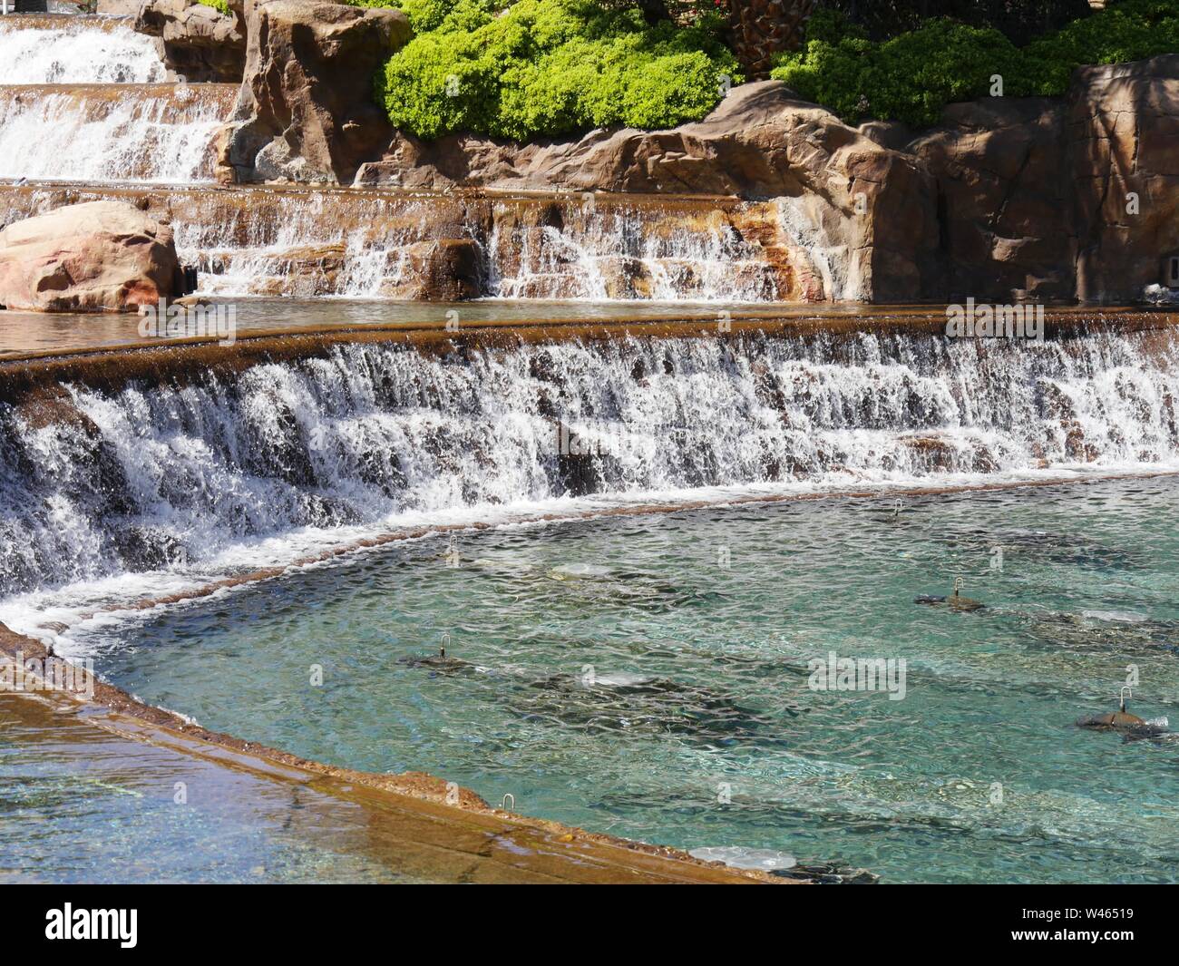 Beautiful view of a man-made waterfalls in a landscaped garden Stock ...