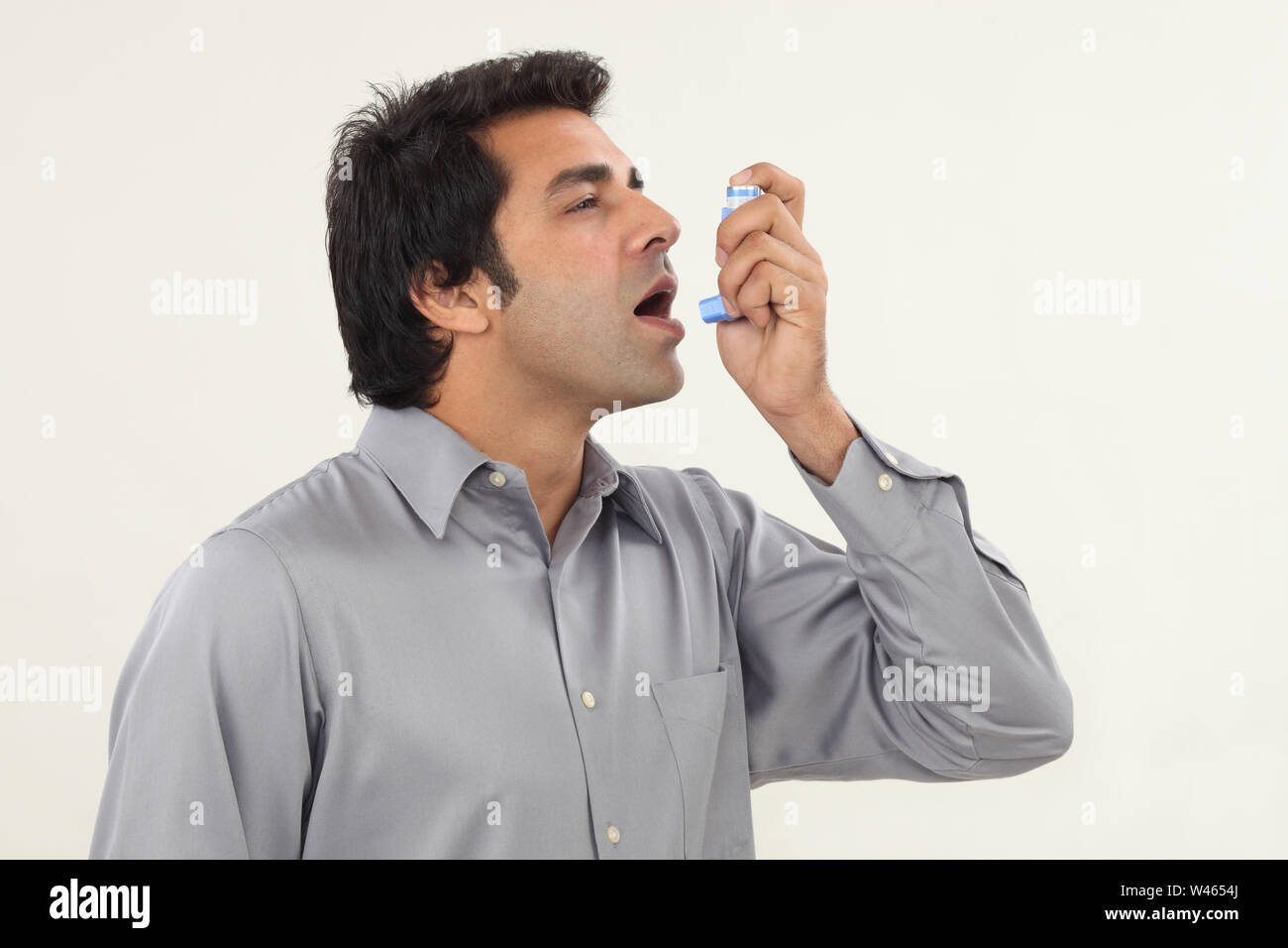 Man using asthma inhaler Stock Photo - Alamy