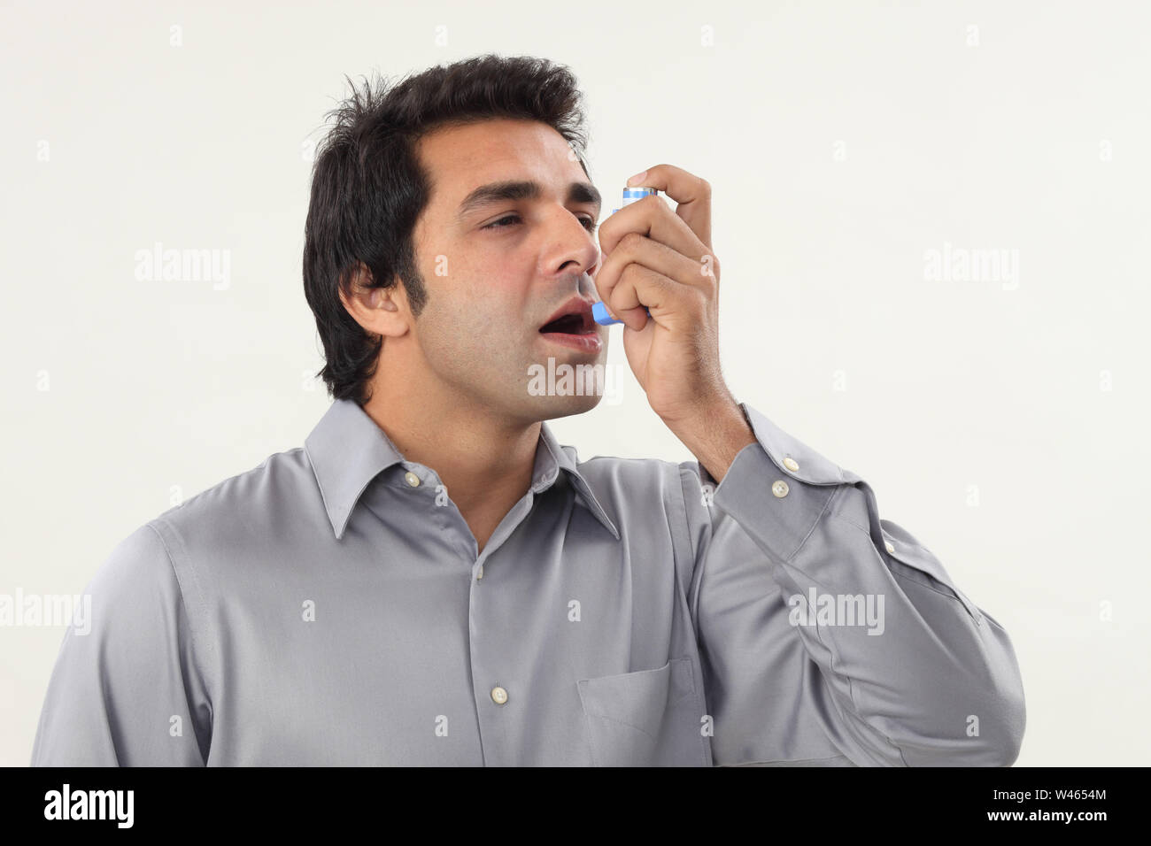 Man using asthma inhaler Stock Photo - Alamy