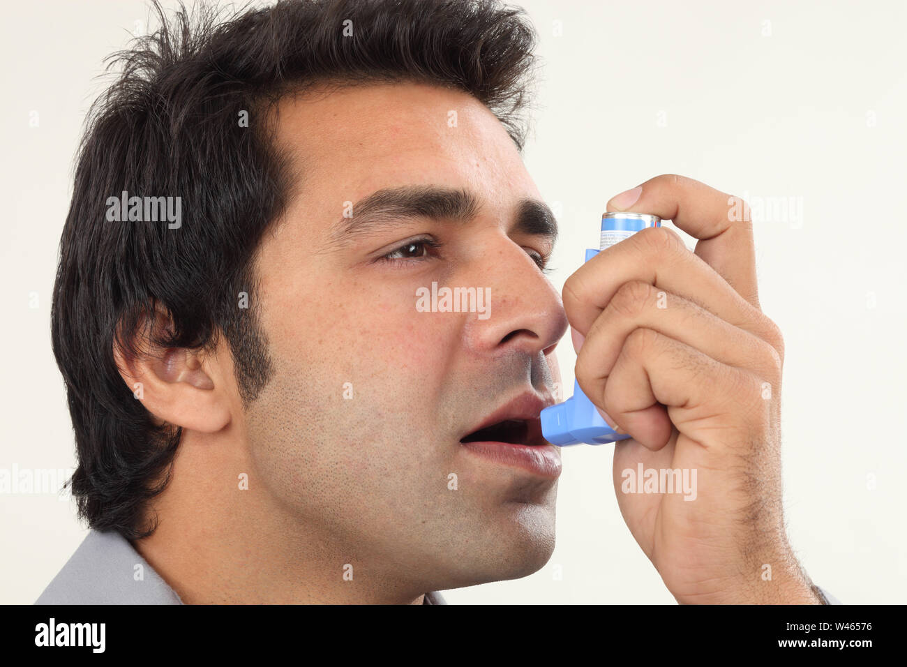 Man using asthma inhaler Stock Photo - Alamy