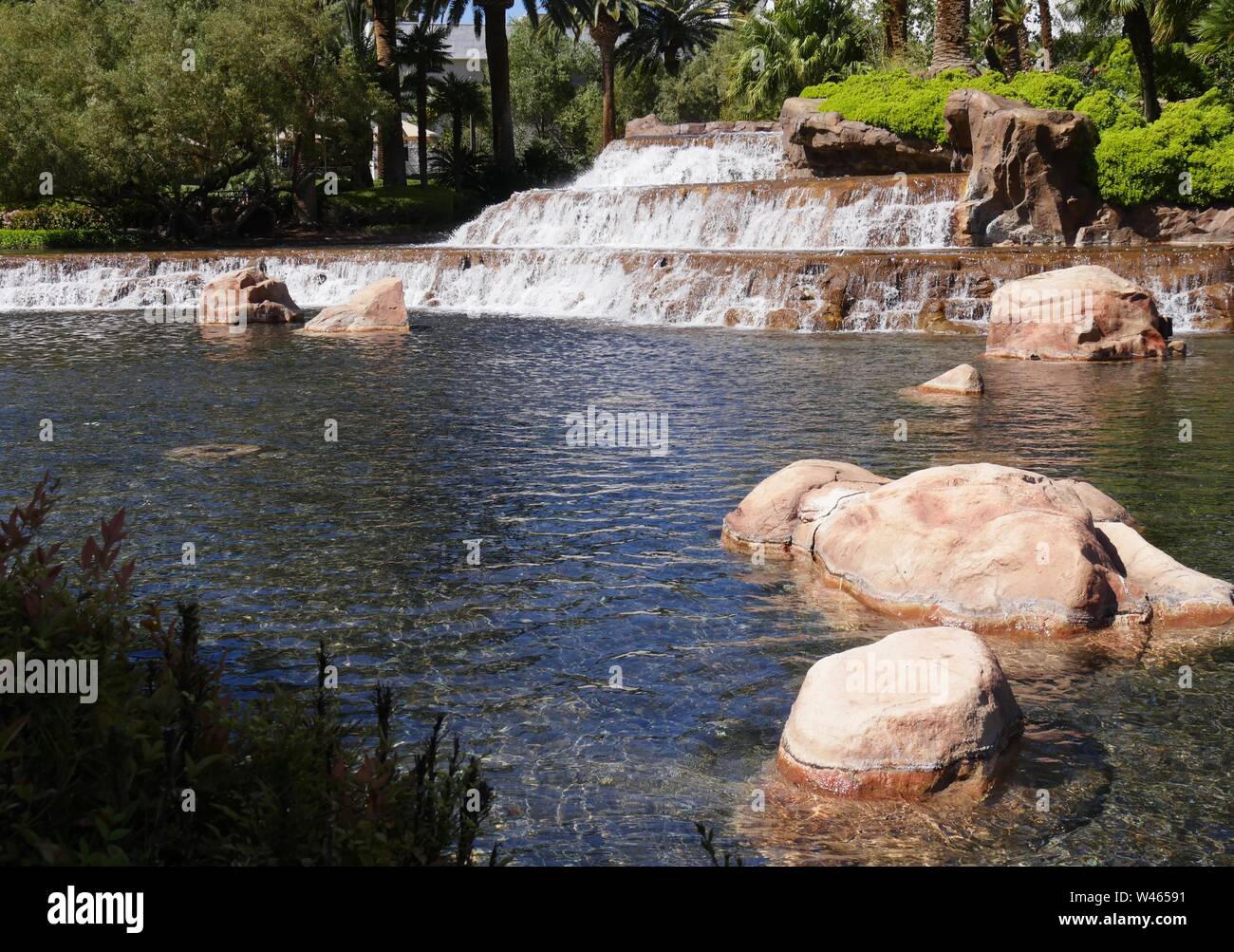 Medium wide view of a backyard garden pond with waterfalls Stock Photo ...
