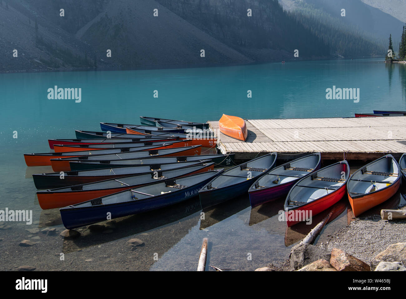 Canoes on moraine lake in banff national park hi-res stock photography ...