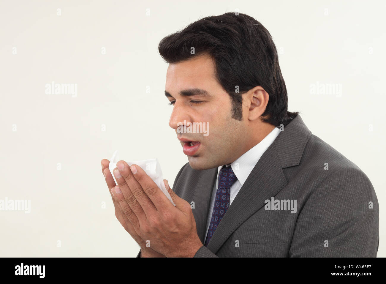Indian man sneezing hi-res stock photography and images - Alamy