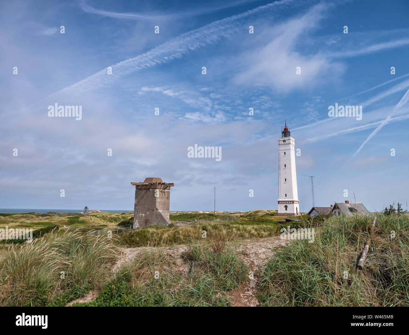 Blaavand lighthouse and WW2 bunker at the Nort Sea coast in Denmark ...