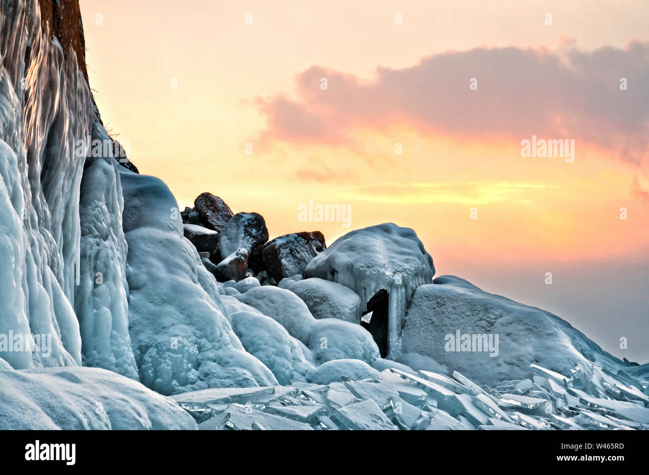 Frozen lake and rocks near the ice cave Stock Photo - Alamy