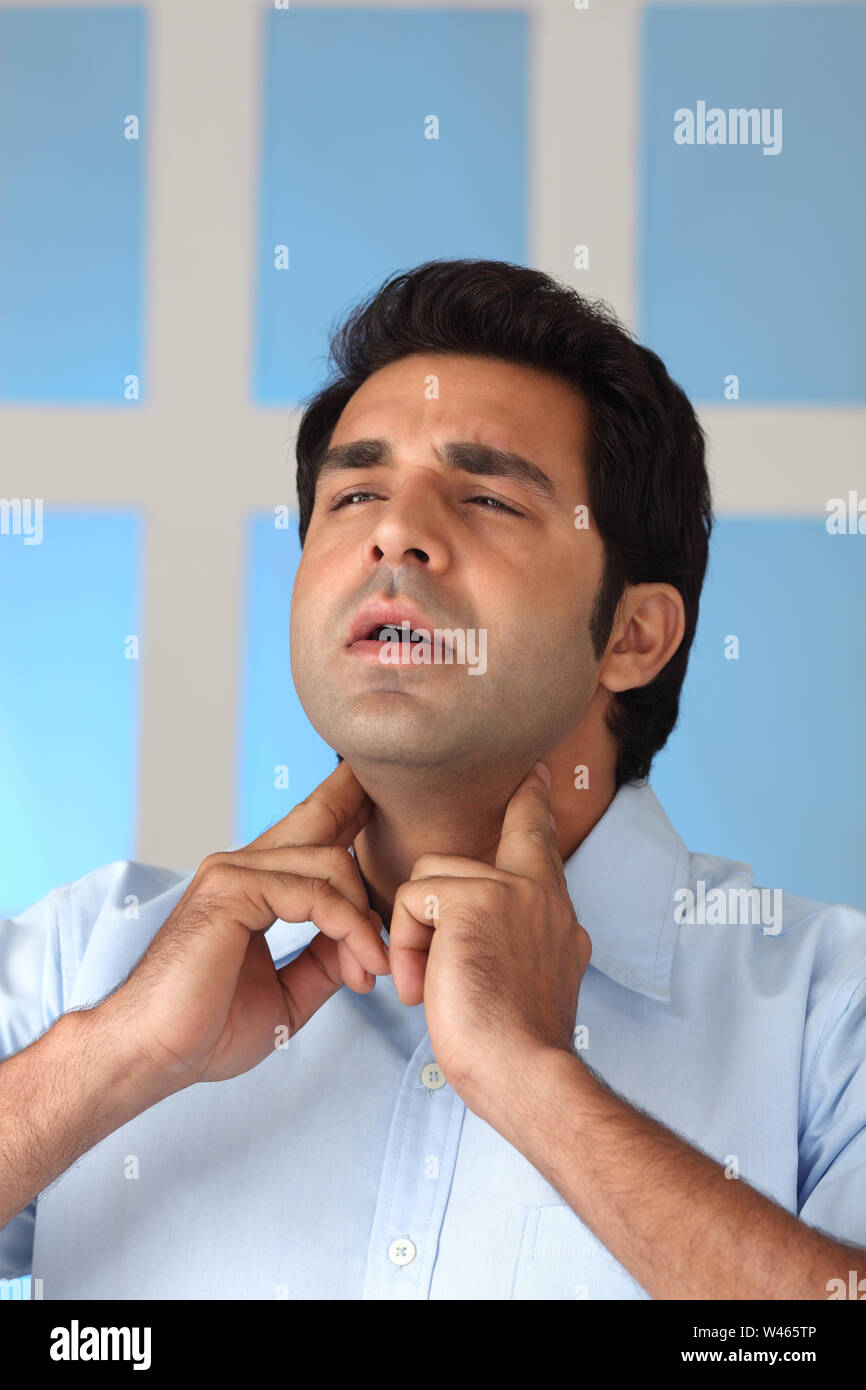 Man suffering from sore throat Stock Photo - Alamy
