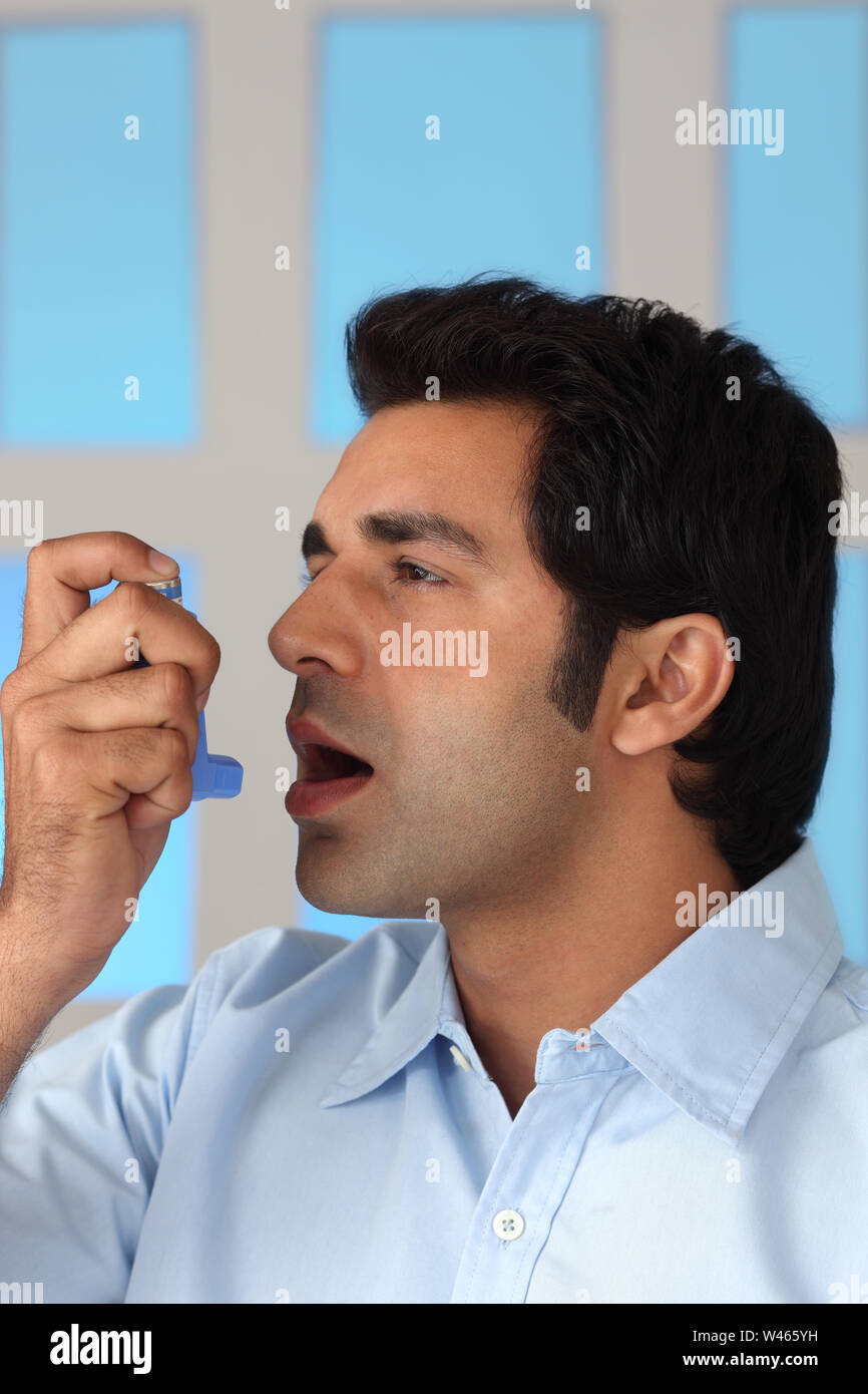 Man using asthma inhaler Stock Photo - Alamy