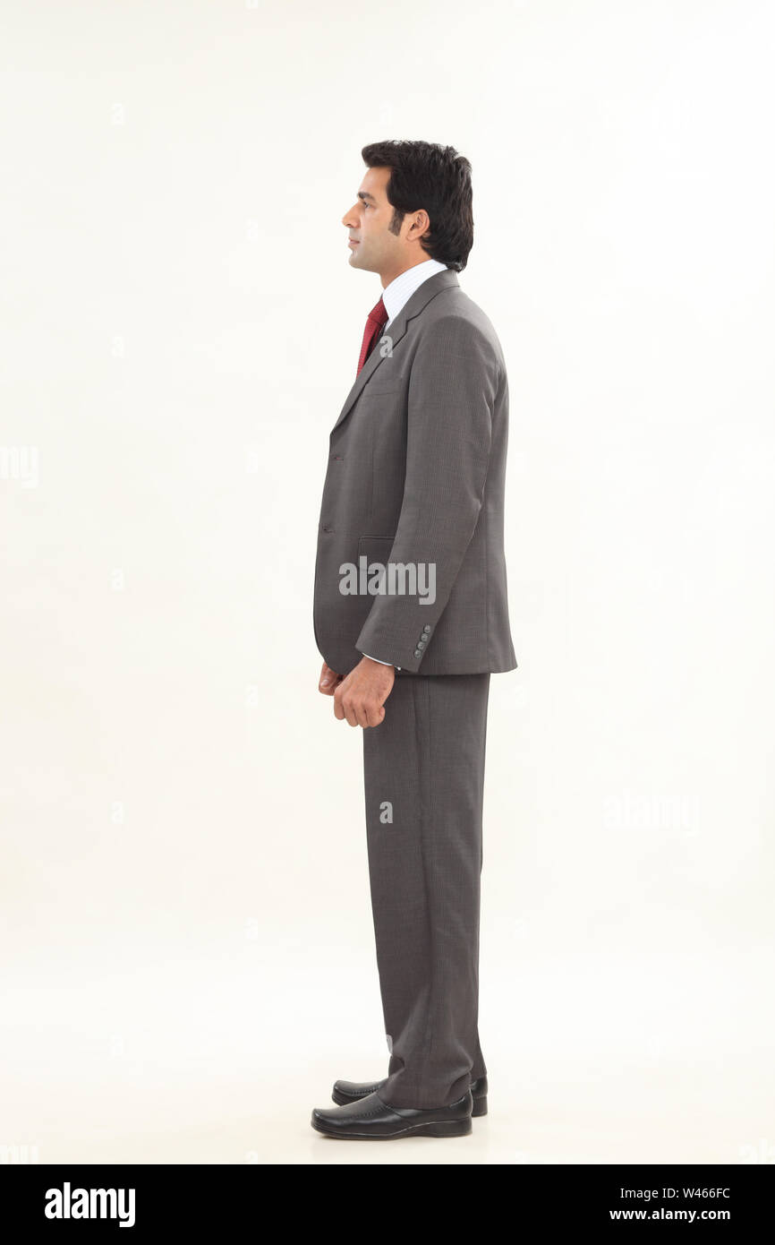 Side profile of a businessman standing Stock Photo - Alamy