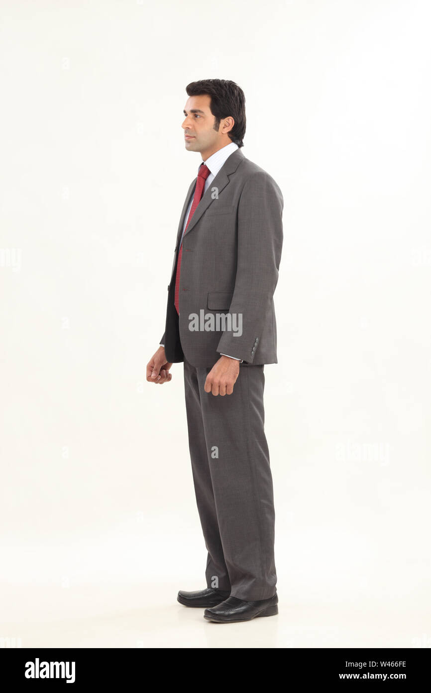 Side profile of a businessman standing Stock Photo - Alamy