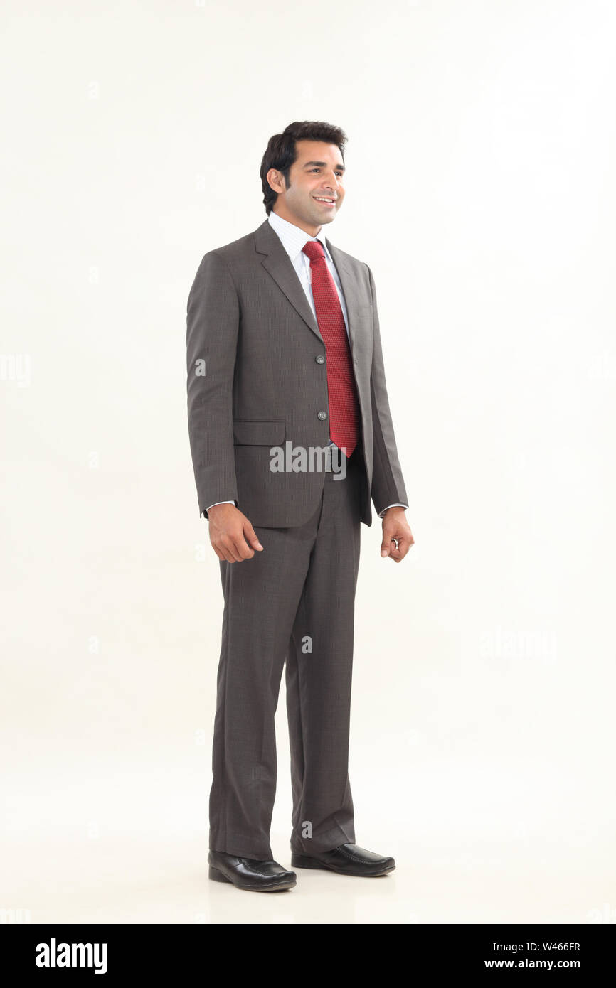SIde profile of a businessman standing Stock Photo - Alamy