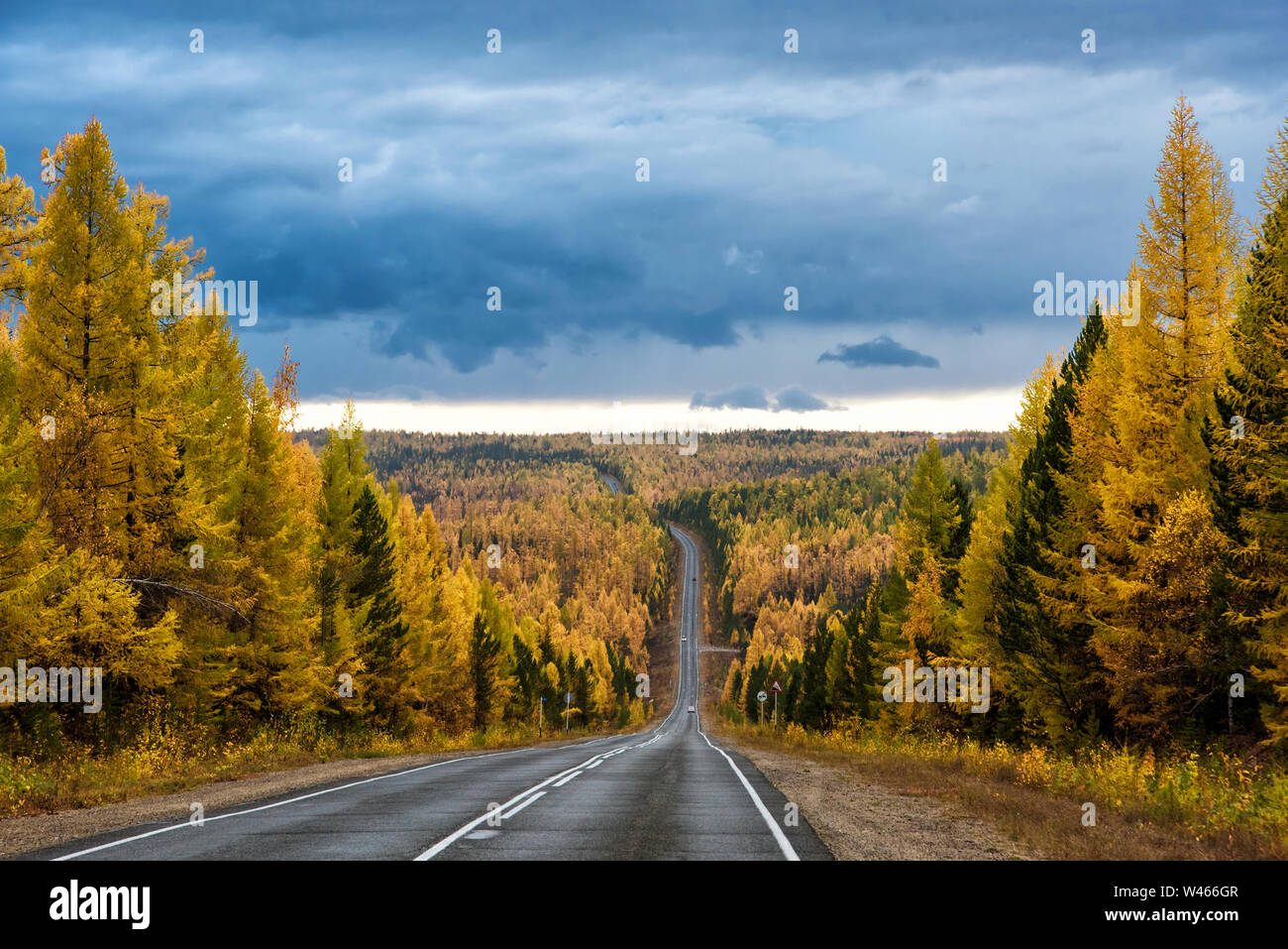 autumn colorful landscape with road and clouds Stock Photo - Alamy