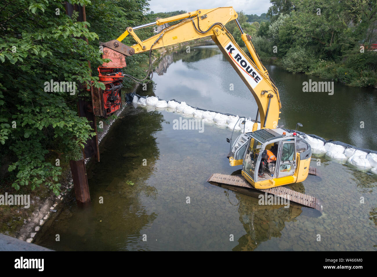 A temporary dam being installed on the River Kent in Kendal, Cumbria ...