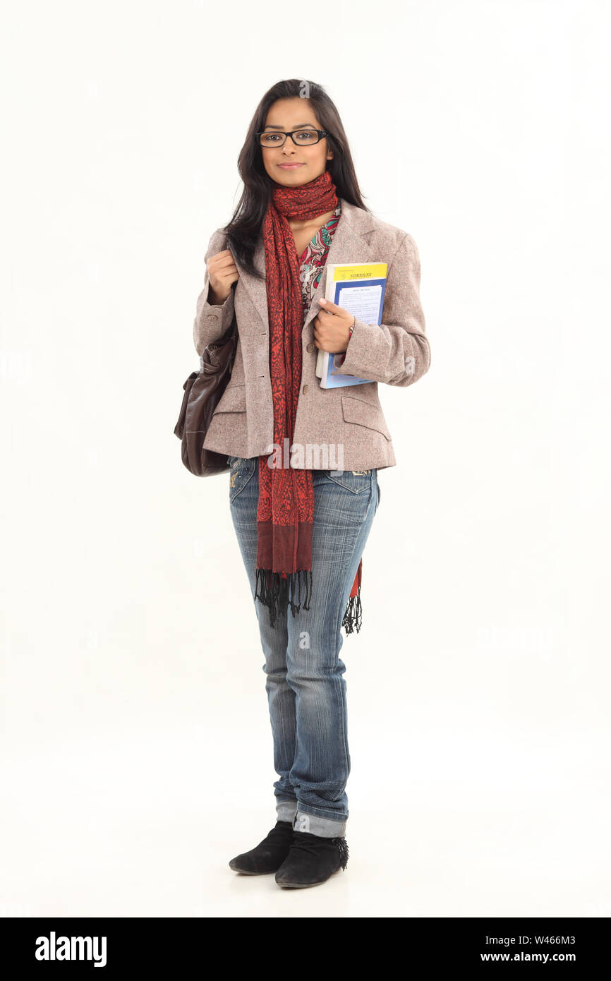 College student holding books Stock Photo - Alamy