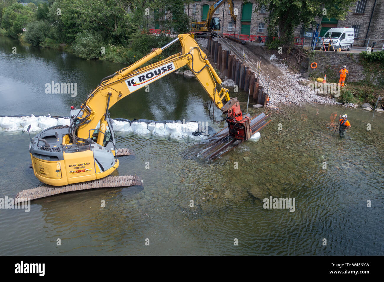 A temporary dam being installed on the River Kent in Kendal, Cumbria ...